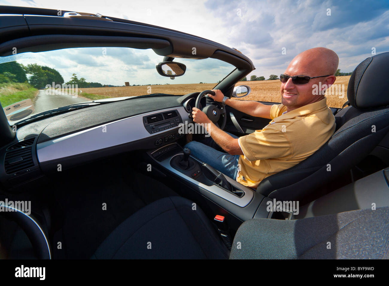 Open top metallic silver BMW Z4 personal luxury rear-wheel drive sports ...