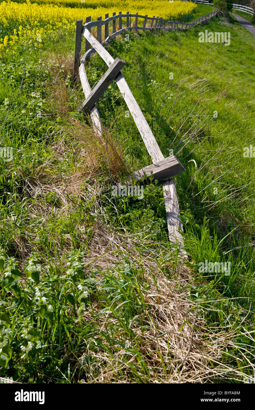 Broken down wooden fence at edge of field JMH4875 Stock Photo - Alamy