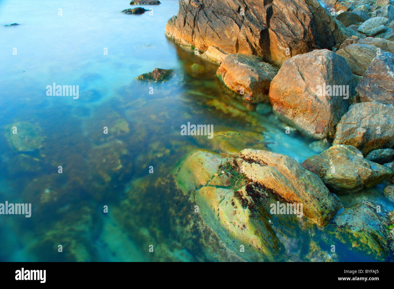 calm japan sea and stones on sanset Stock Photo - Alamy