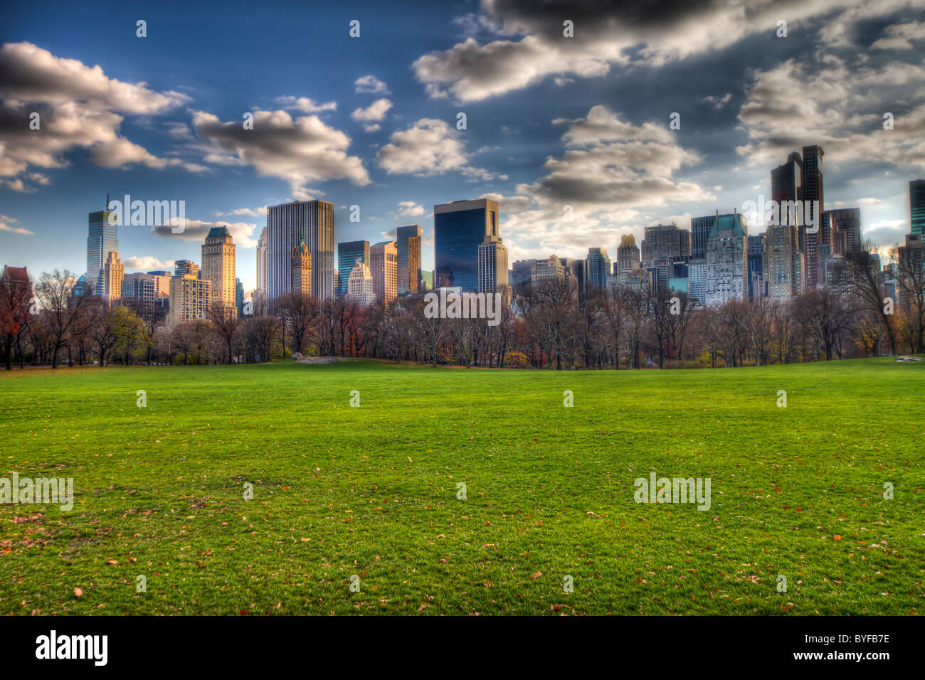 Great Lawn in Central Park and Midtown Manhattan Skyline at Sunset ...