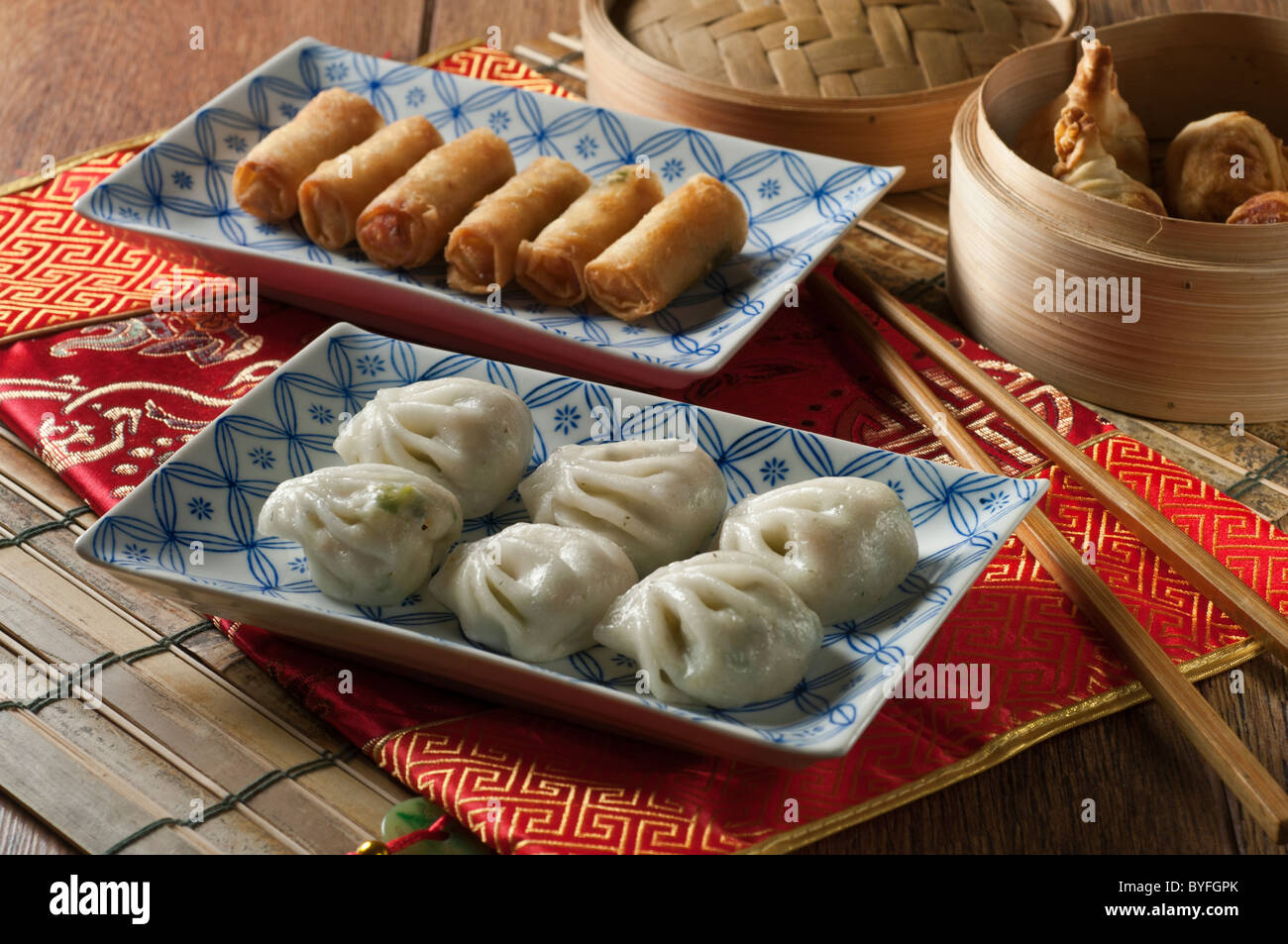 Steamed dumplings and spring rolls. Dim sum Stock Photo - Alamy