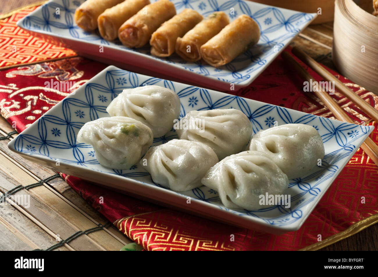 Steamed dumplings and spring rolls. Dim sum Stock Photo - Alamy