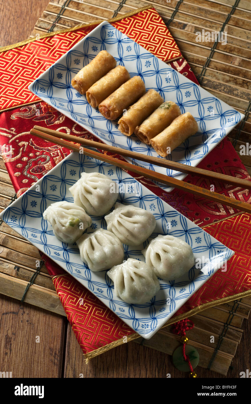 Steamed dumplings and spring rolls. Dim sum Stock Photo - Alamy