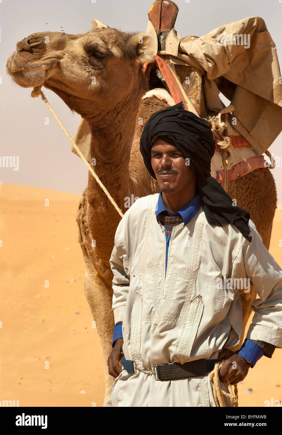 Camel driver with camel on Sahara desert, Mauritania Stock Photo - Alamy