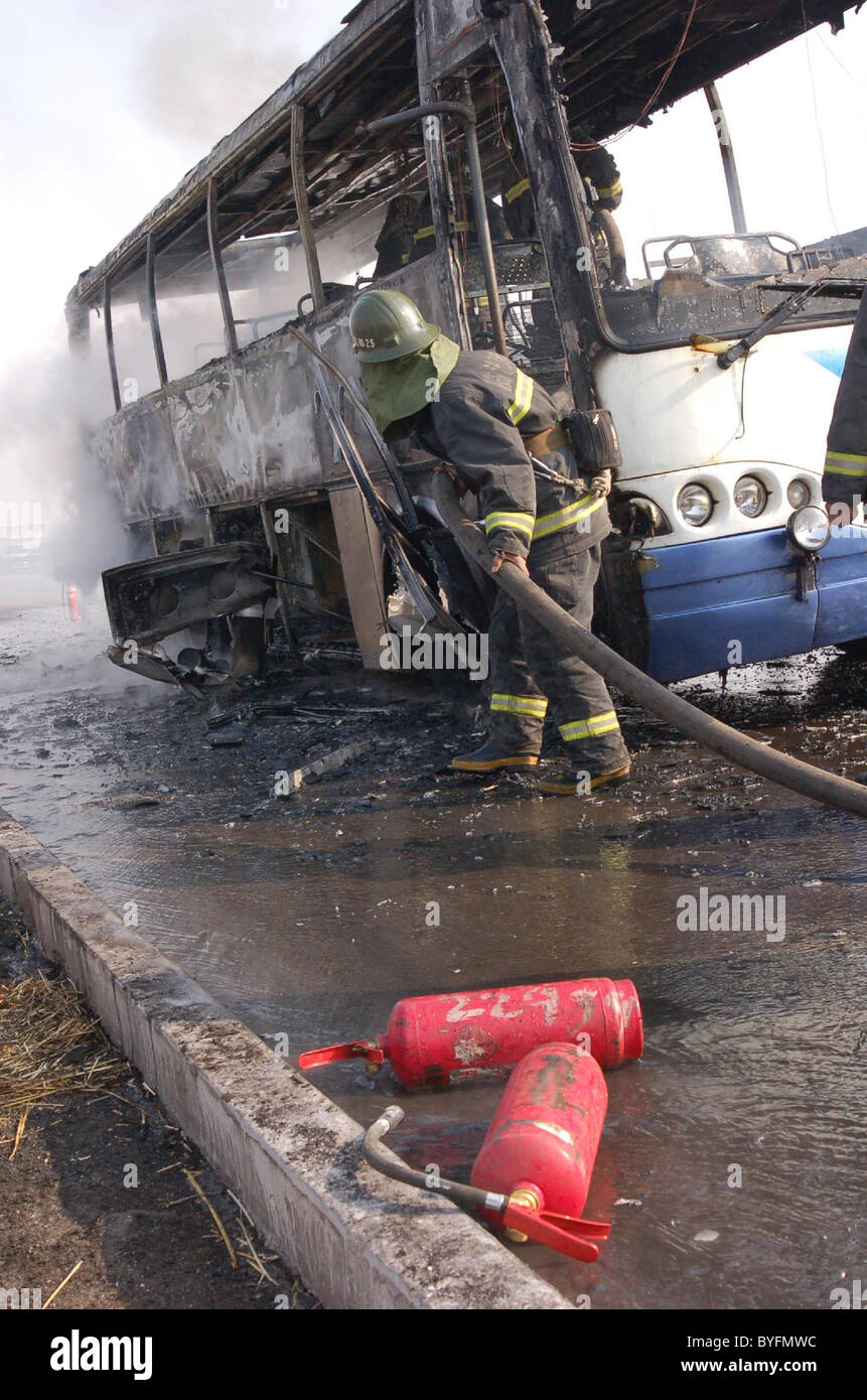 TWENTY-TWO FLEE BUS INFERNO Chinese firefighters battle to control a ...