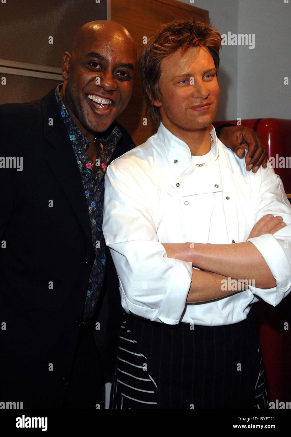Ainsley Harriott posing with a Madame Tussauds Jamie Oliver wax figure ...