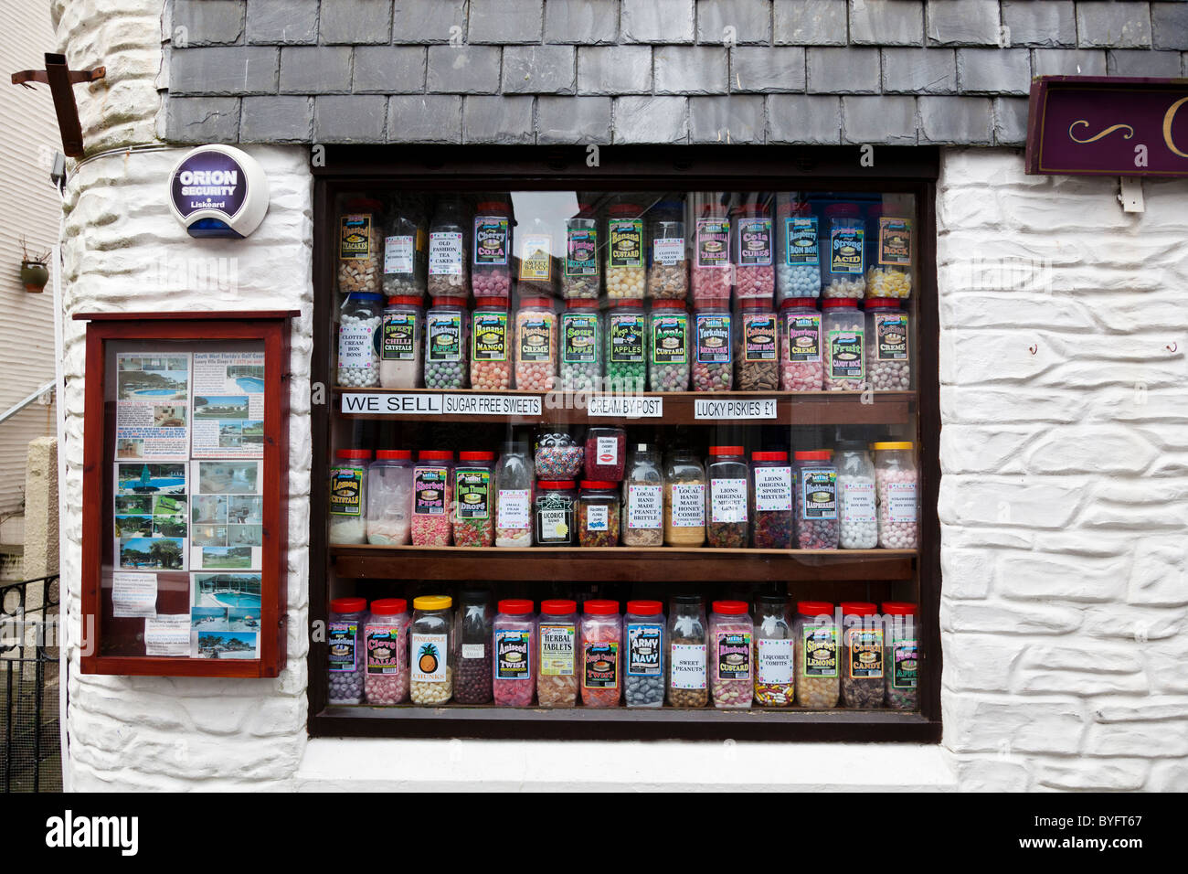 Old fashioned sweet shop with a window display of sweet jars in ...