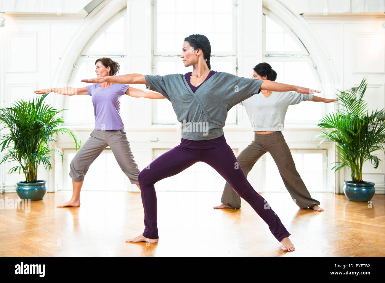 Three women exercising Stock Photo - Alamy