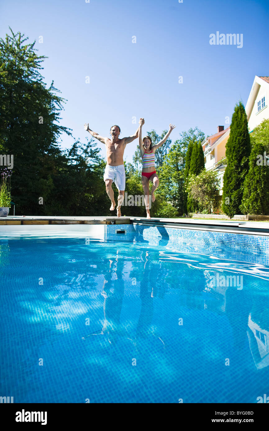 Child jumping fathers arms hi-res stock photography and images - Alamy