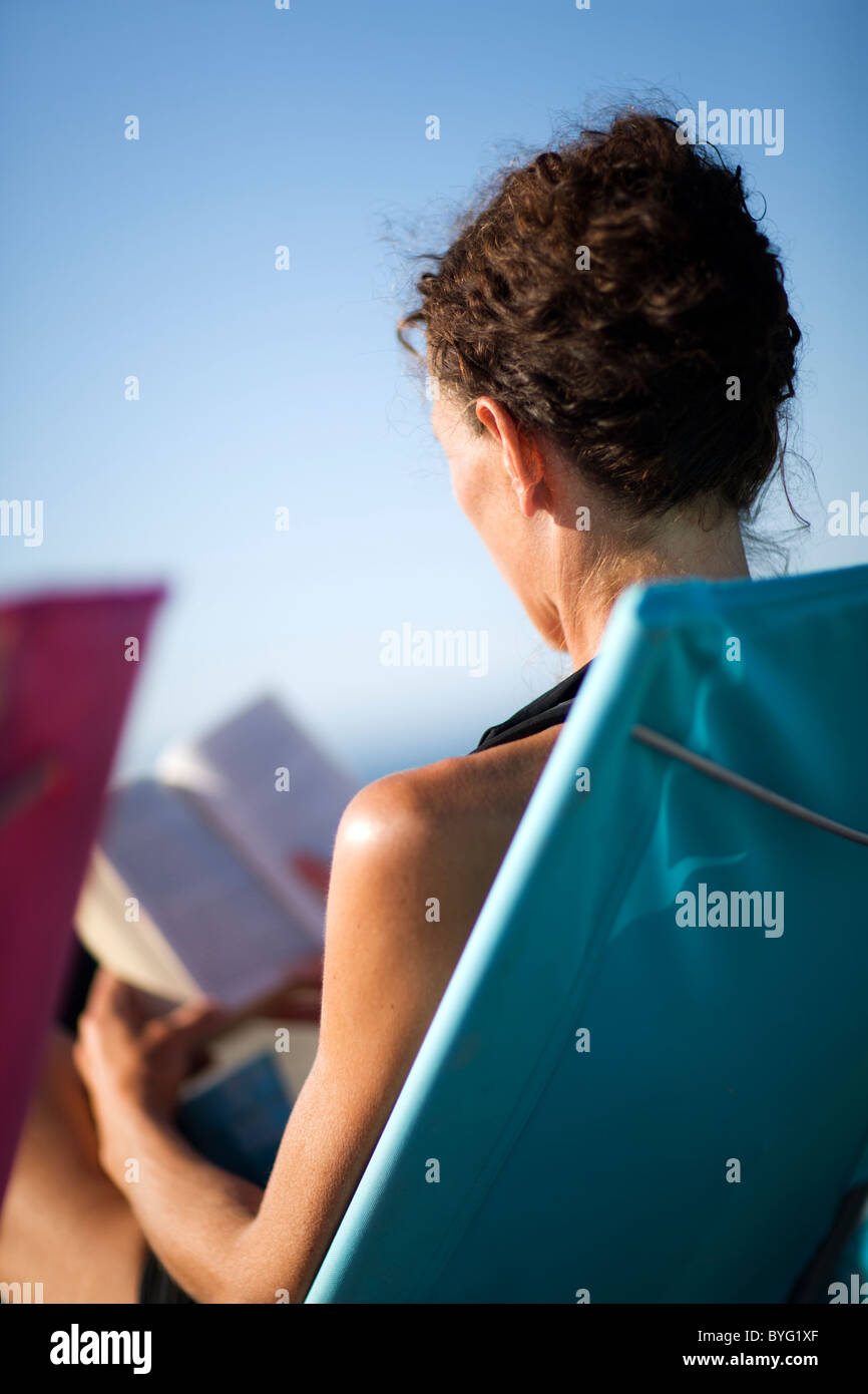 Rear view seated woman chair hi-res stock photography and images - Alamy