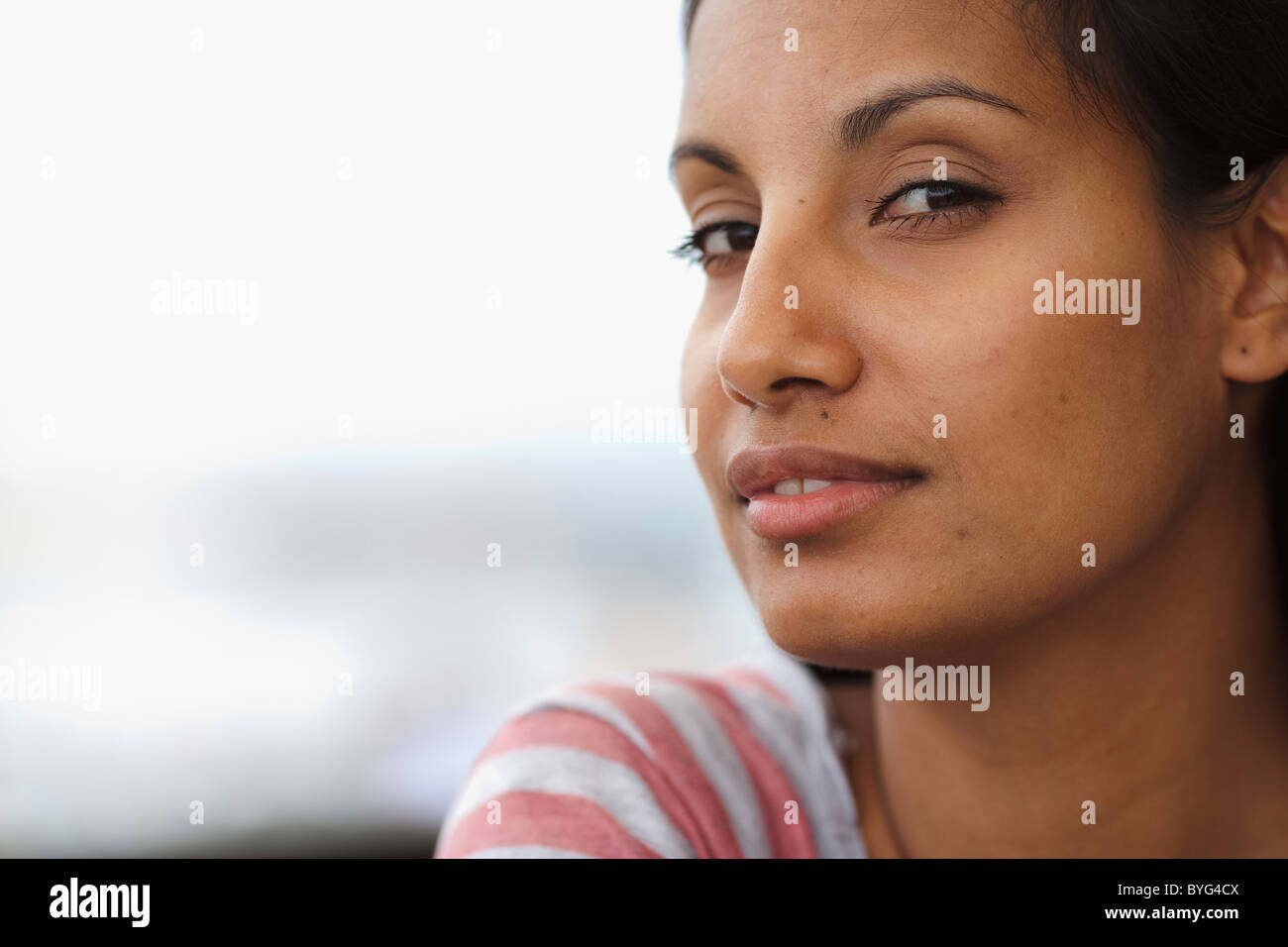 Portrait of woman smiling outdoors Stock Photo - Alamy