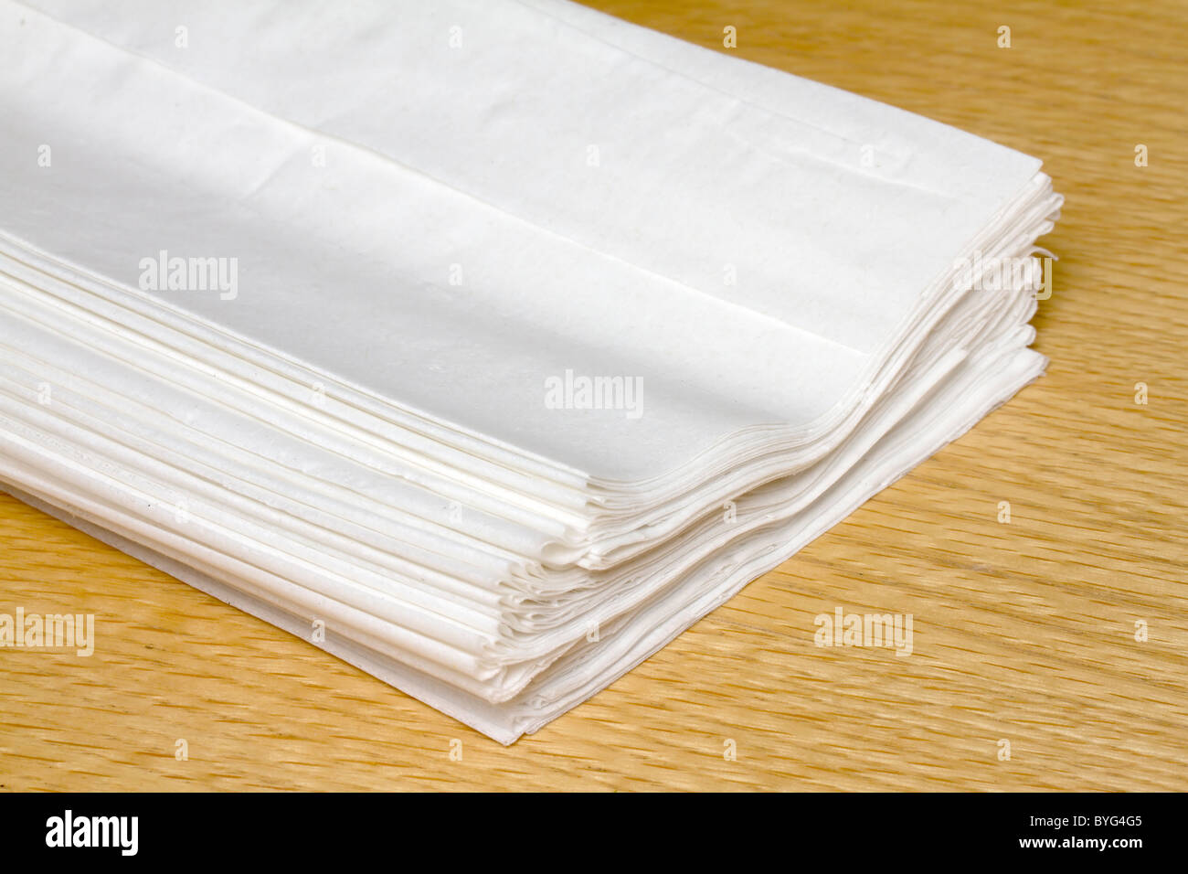 Tissues on wooden table Stock Photo - Alamy