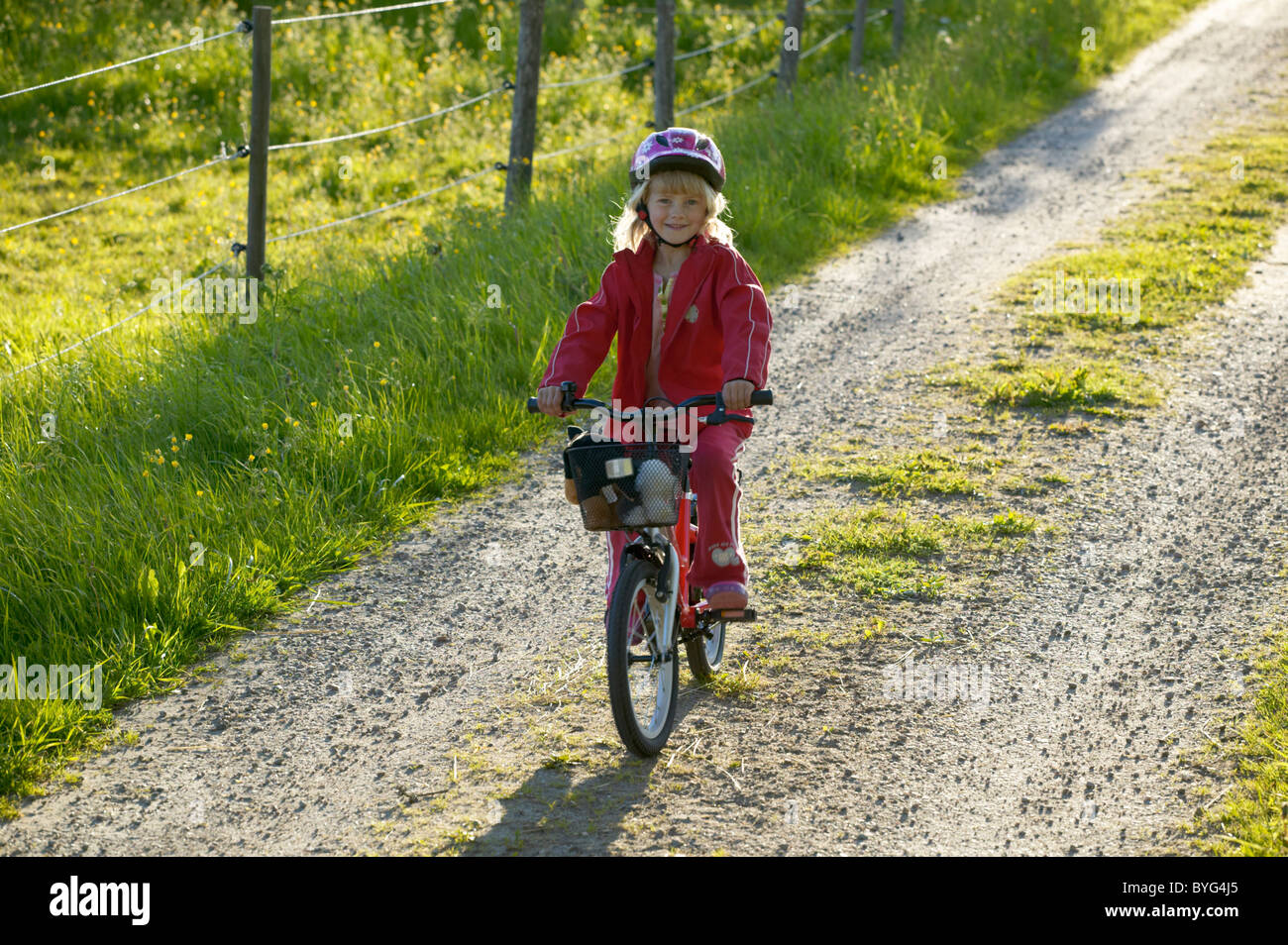 Girl riding bicycle Stock Photo - Alamy