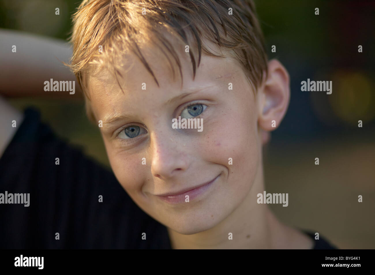Portrait of boy smiling outdoors Stock Photo - Alamy