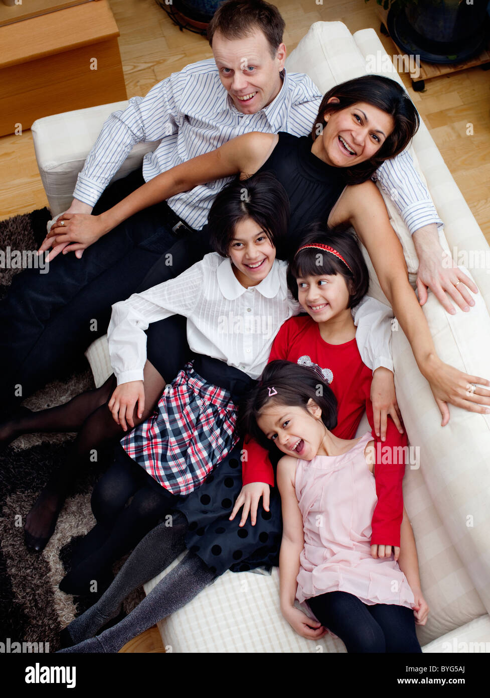 Portrait of family with three children Stock Photo - Alamy