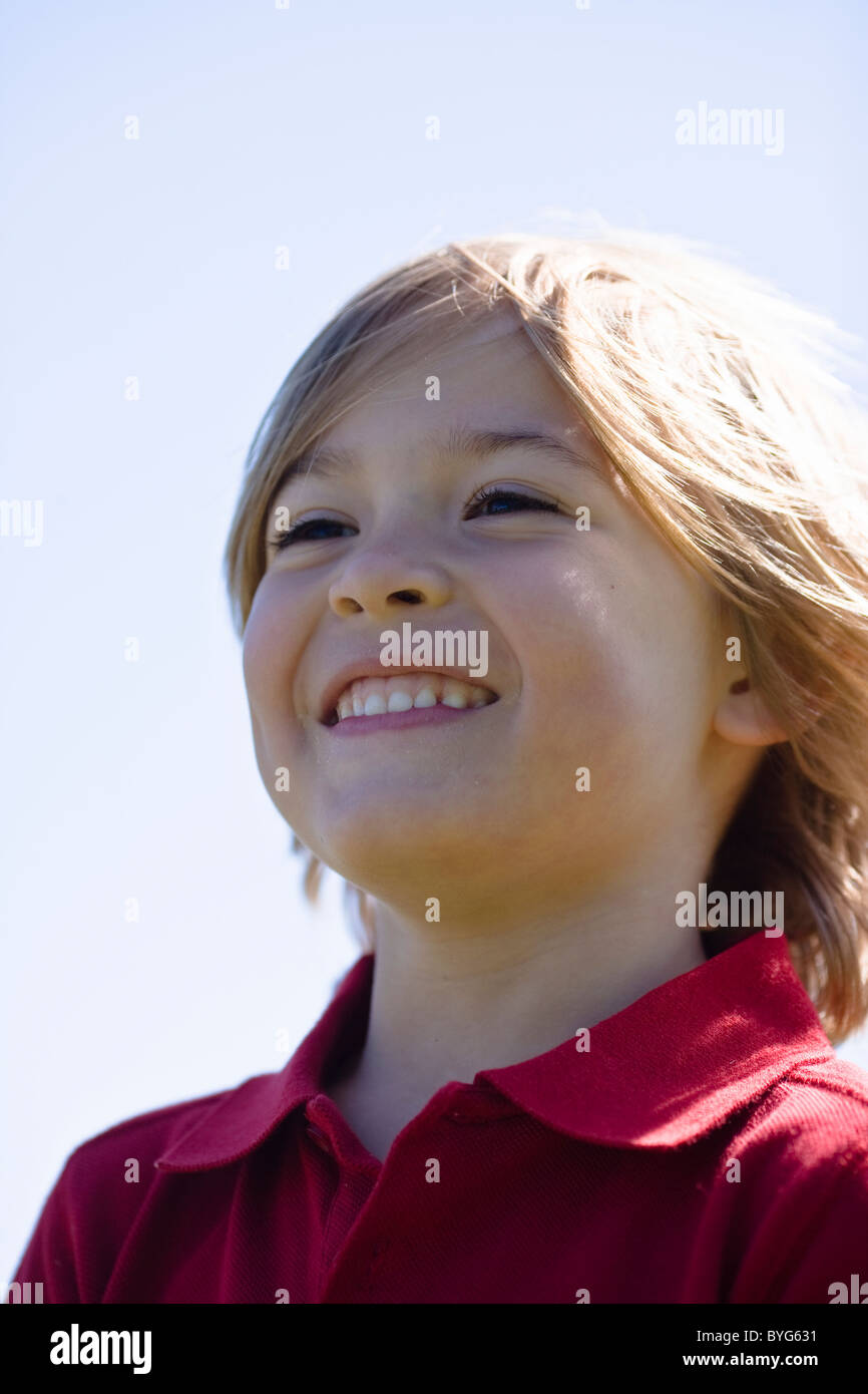 Portrait of smiling boy in bright sunlight Stock Photo - Alamy