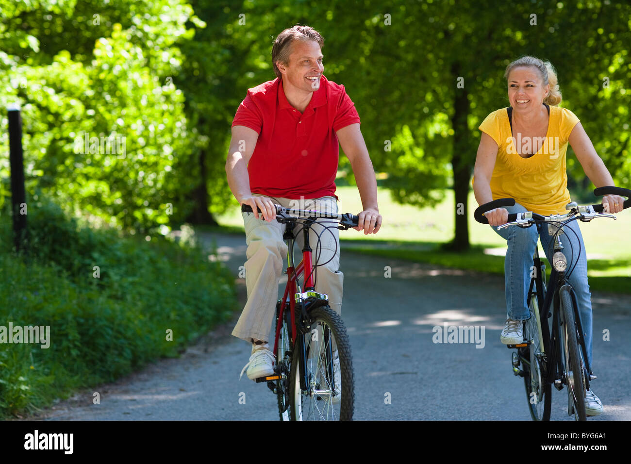 Couples biking park fun hi-res stock photography and images - Alamy