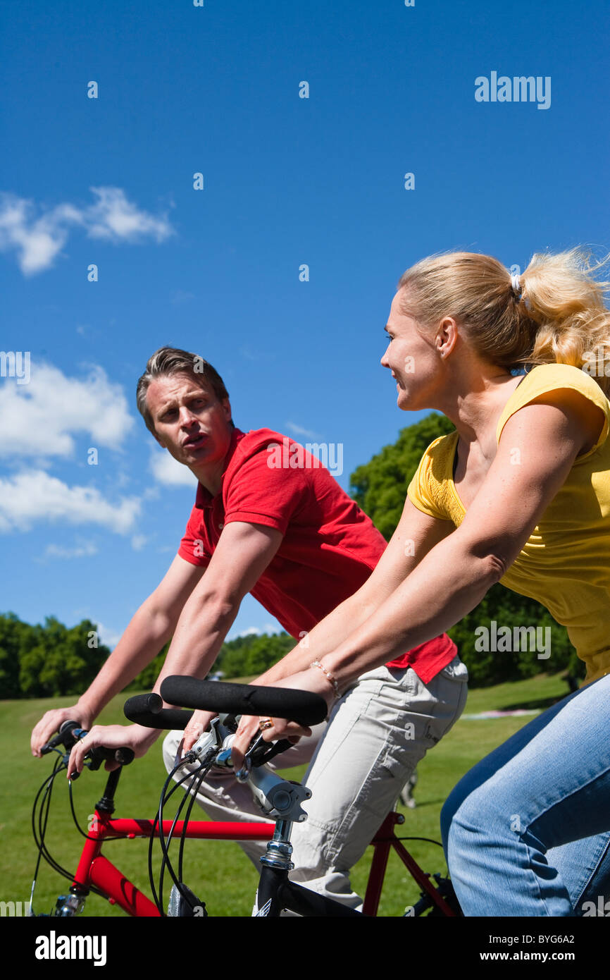 Young couples riding bike hi-res stock photography and images - Alamy