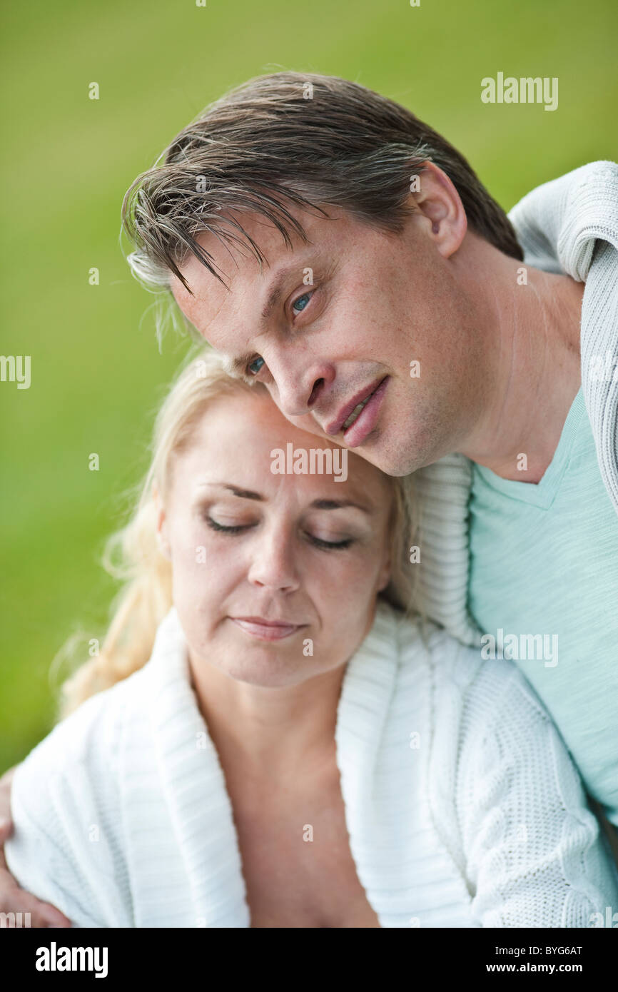 Young couple embracing Stock Photo - Alamy
