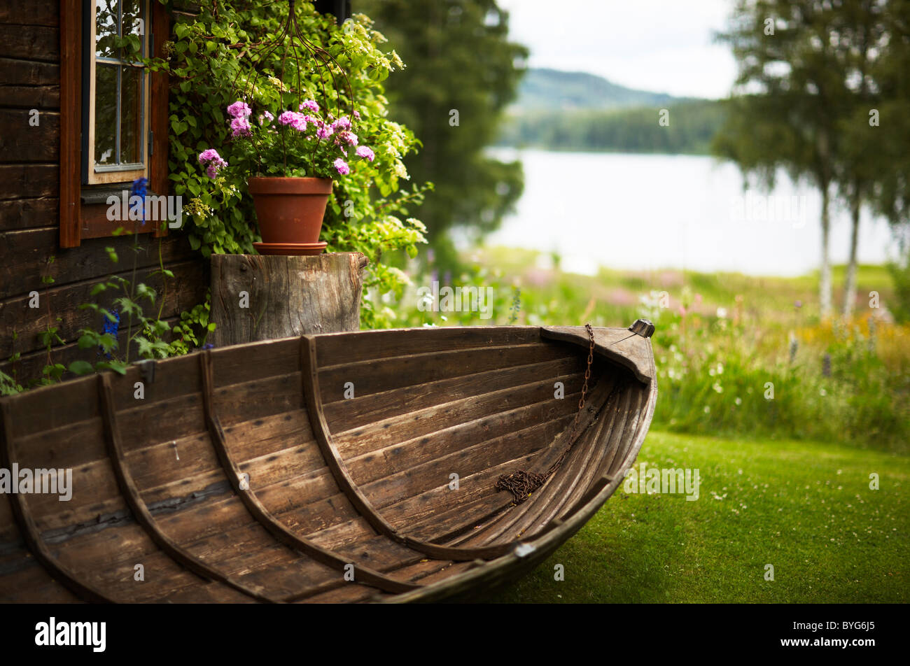 Wooden rowboat in backyard Stock Photo - Alamy