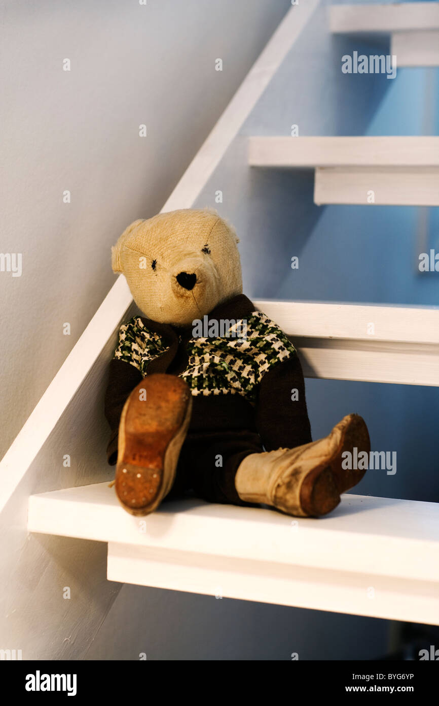 Teddy bear on steps Stock Photo - Alamy