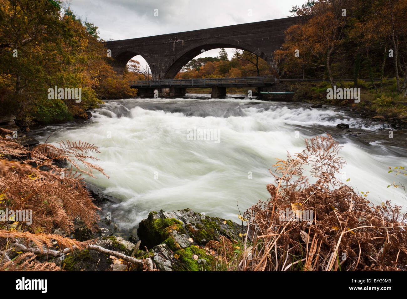 The fast flowing River Morar flows from Loch Morar under the railway ...