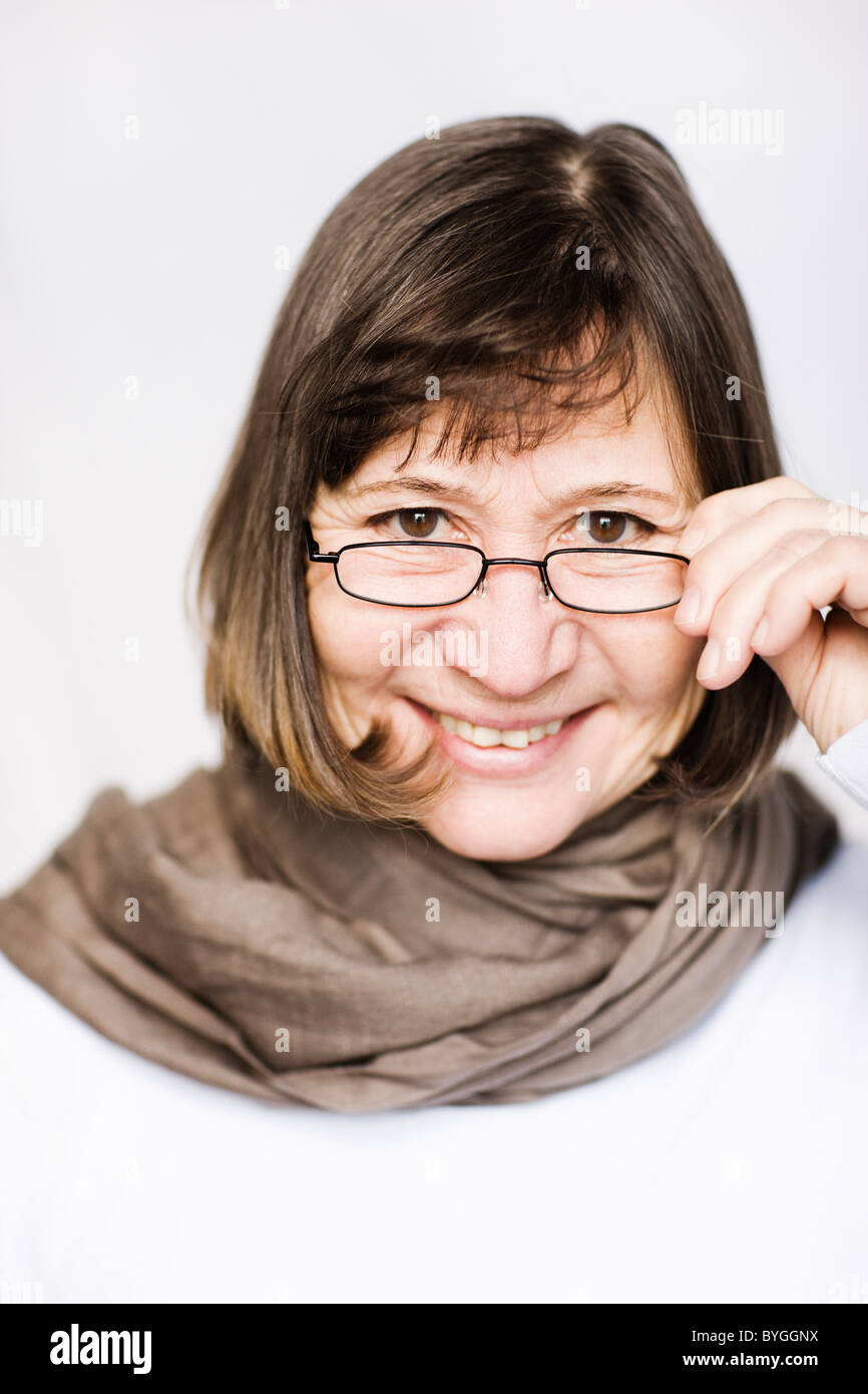 Smiling woman wearing spectacles Stock Photo - Alamy
