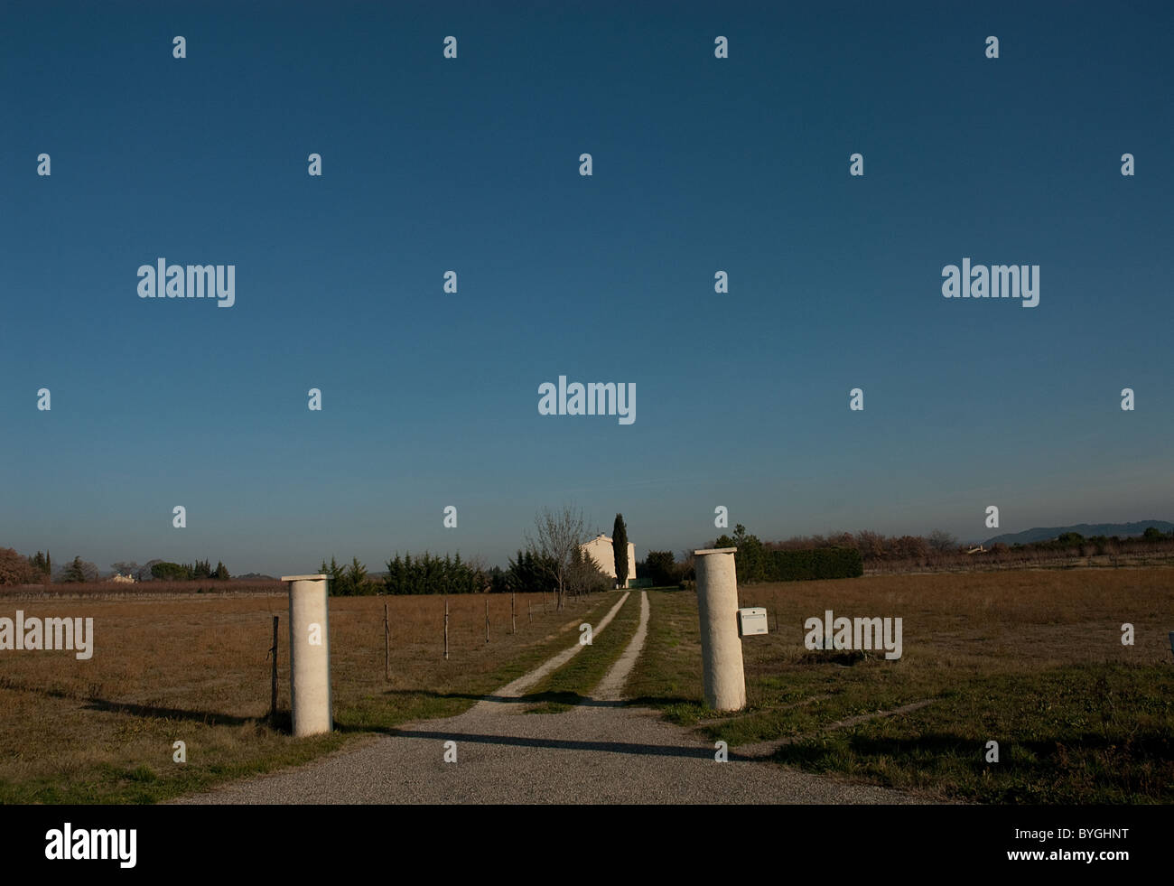 Entrance with no gates of fencing Stock Photo - Alamy