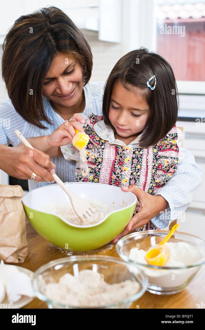Mother baking with daughter in kitchen Stock Photo - Alamy