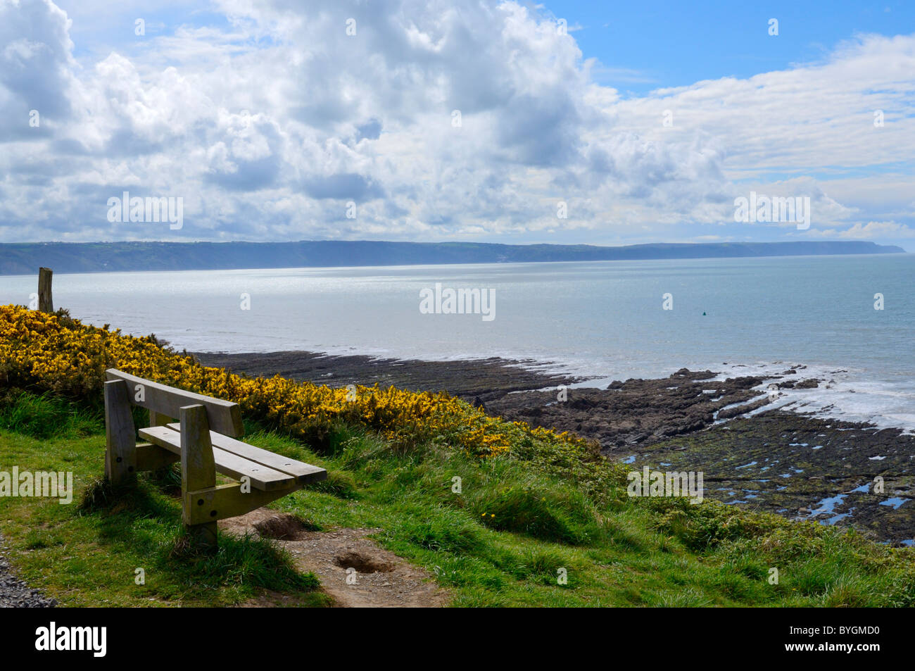 A bench on the cliffs overlooking the sea and Cornborugh Range near ...