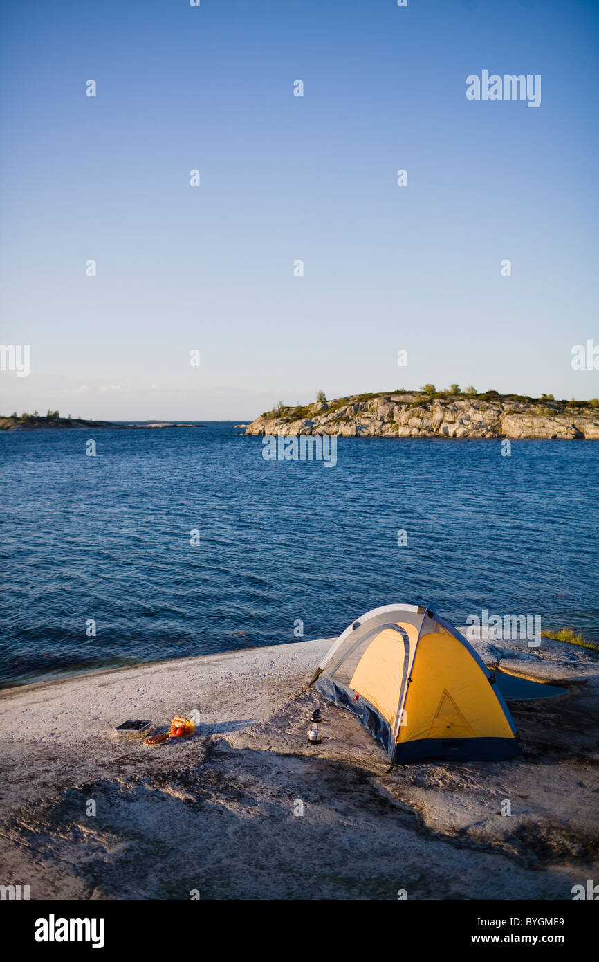 Tent on beach by sea Stock Photo - Alamy