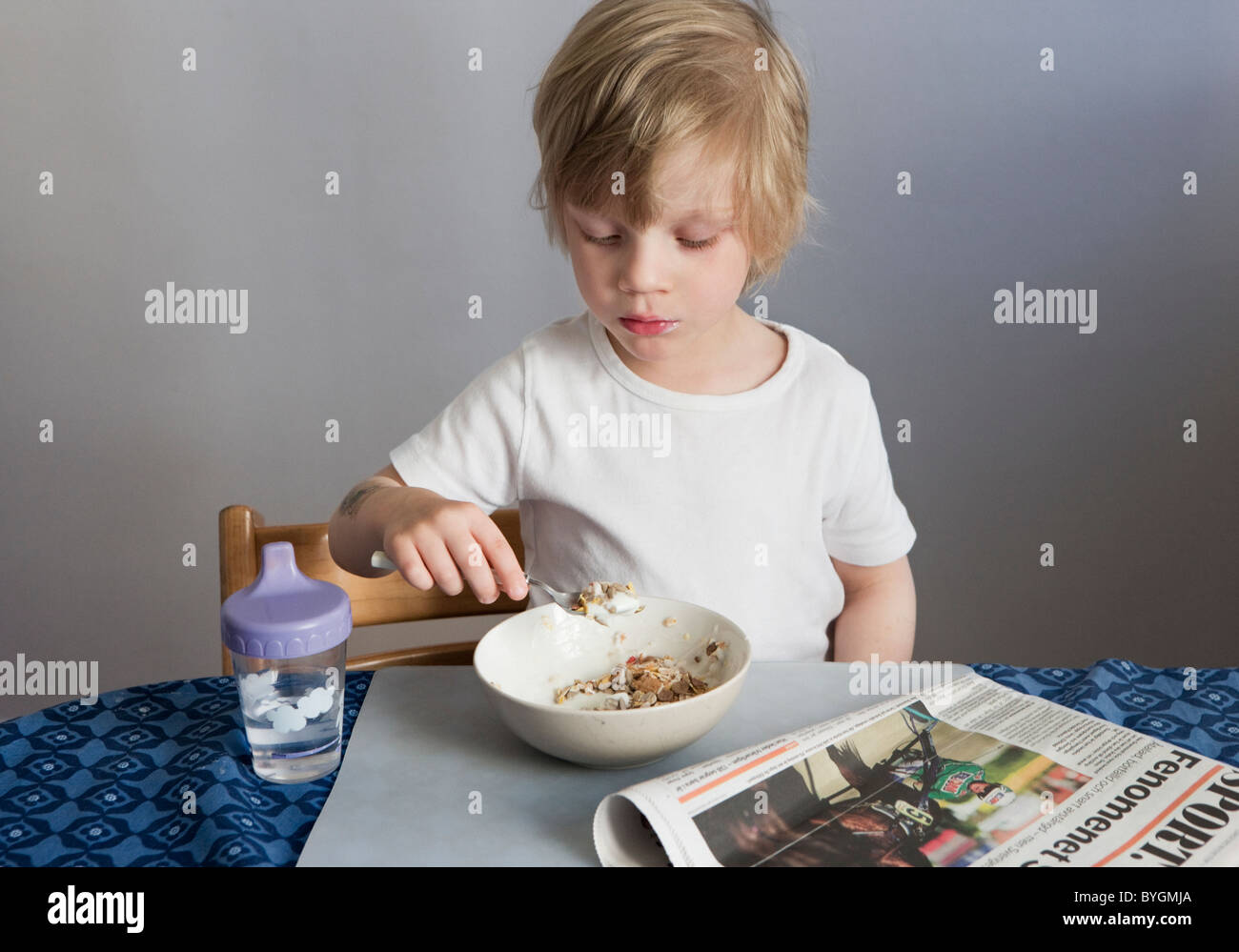 Boy eating breakfast Stock Photo - Alamy