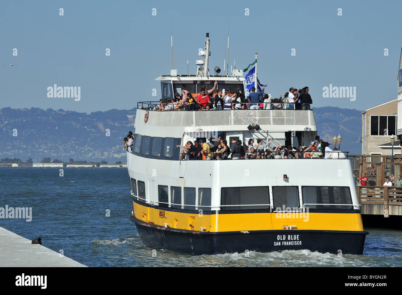 The ferry Old Blue of the Blue and Gold Fleet takes a party of tourists ...