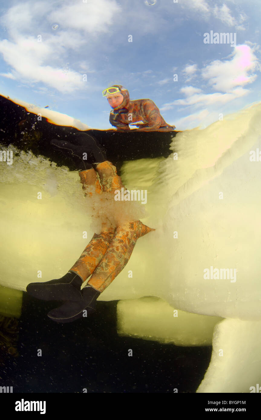 Split level, under ice freediving in Arctic Stock Photo - Alamy