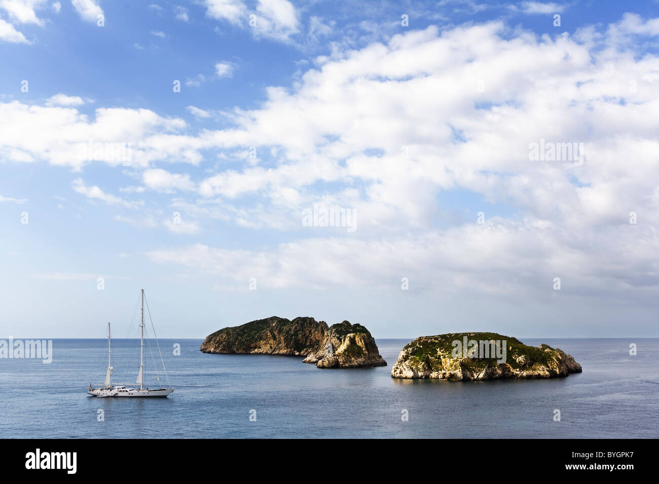 Sailing boat near islands at sea Stock Photo - Alamy