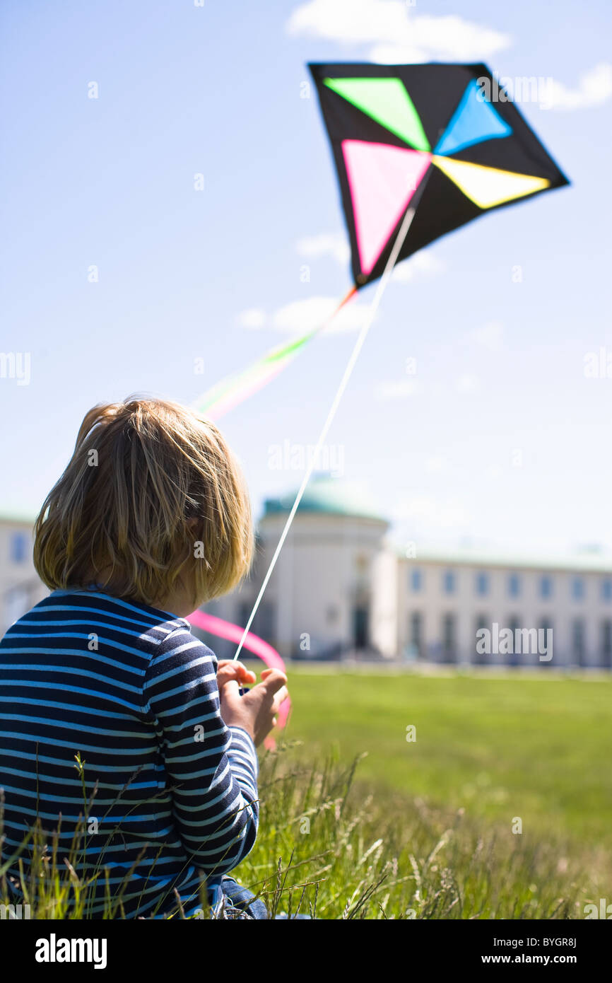 Boy flying kite in bright sunlight Stock Photo - Alamy