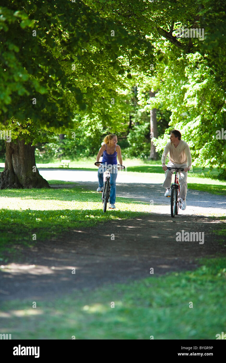 Young couples riding bike hi-res stock photography and images - Alamy
