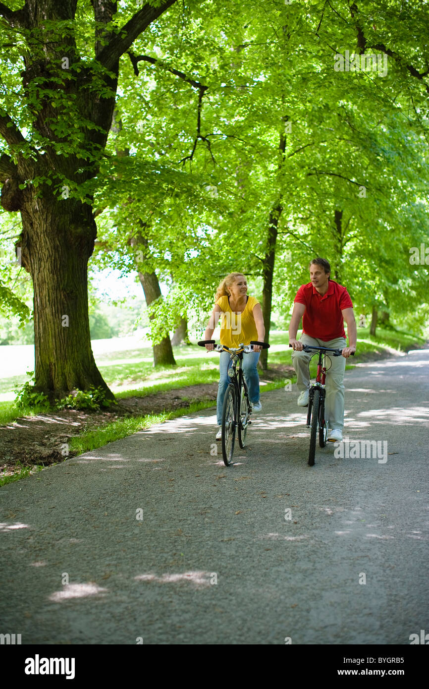 Couples biking park fun hi-res stock photography and images - Alamy
