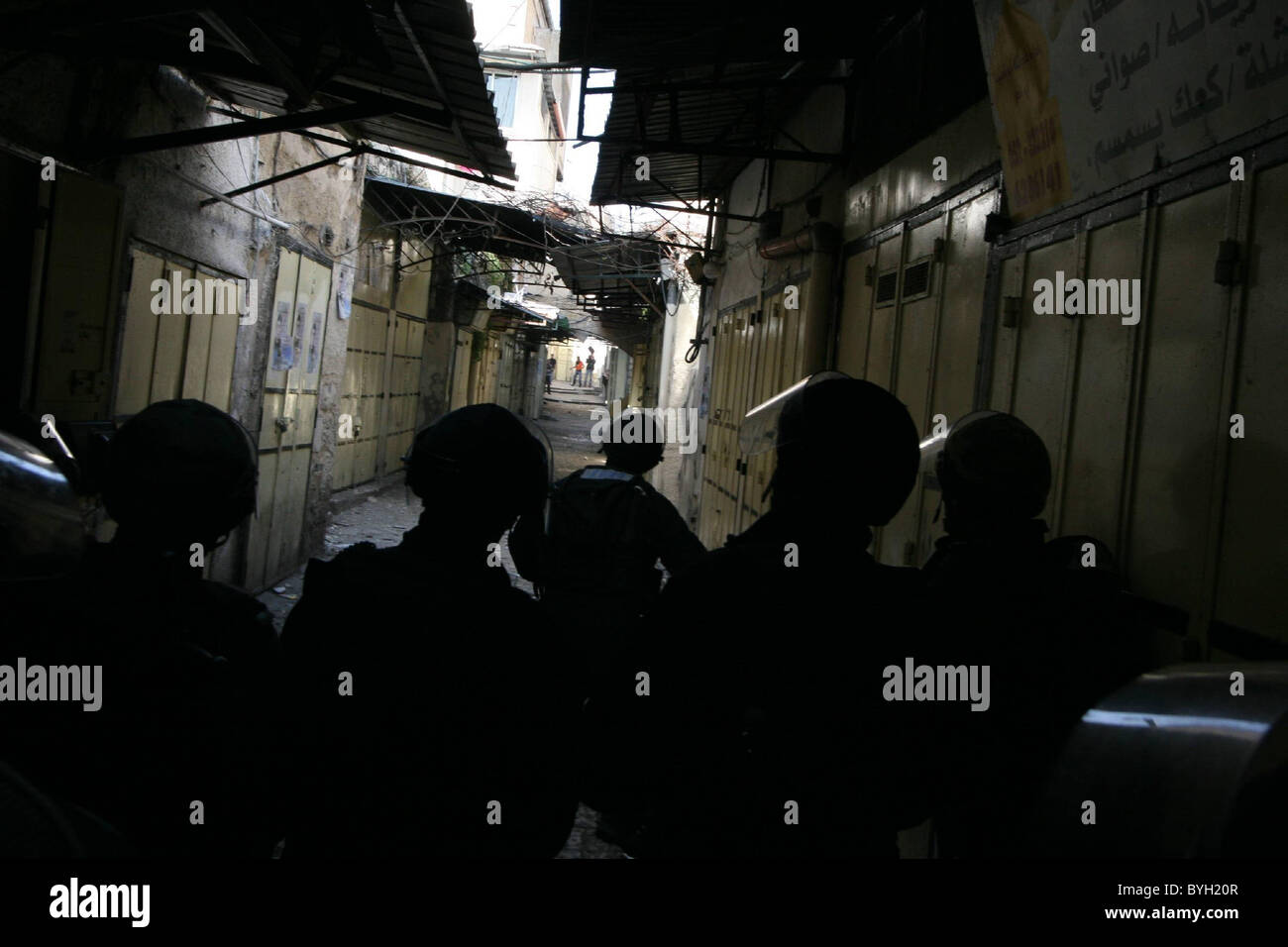 Police run after stone throwing Arab youth in the narrow alleys of the ...