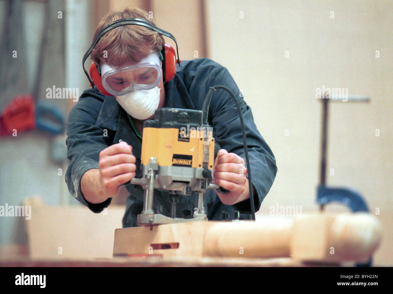 Woodmachining. Operative using a router Stock Photo - Alamy