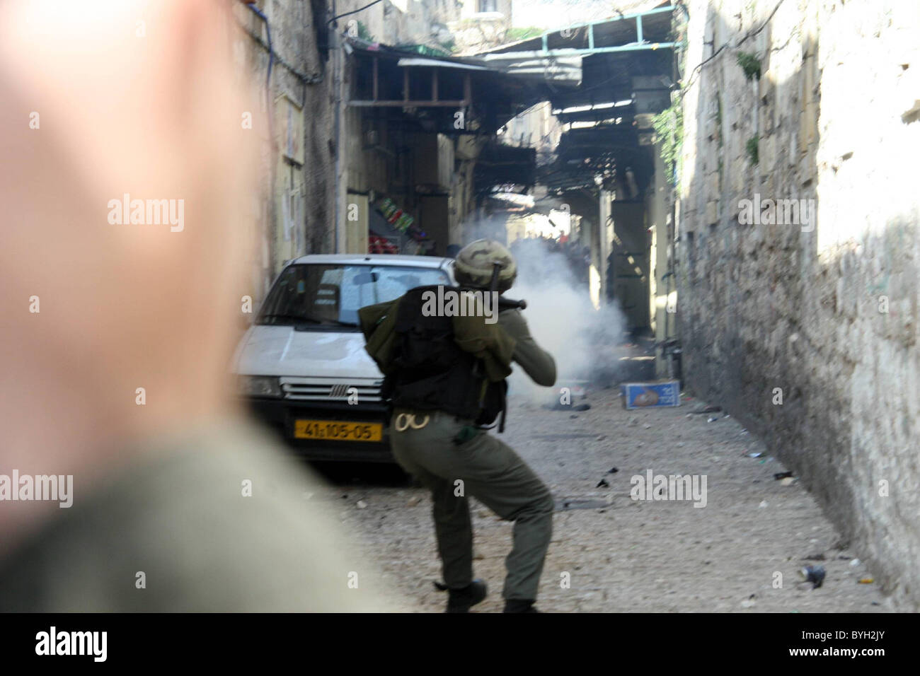 Police run after stone throwing Arab youth in the narrow alleys of the ...