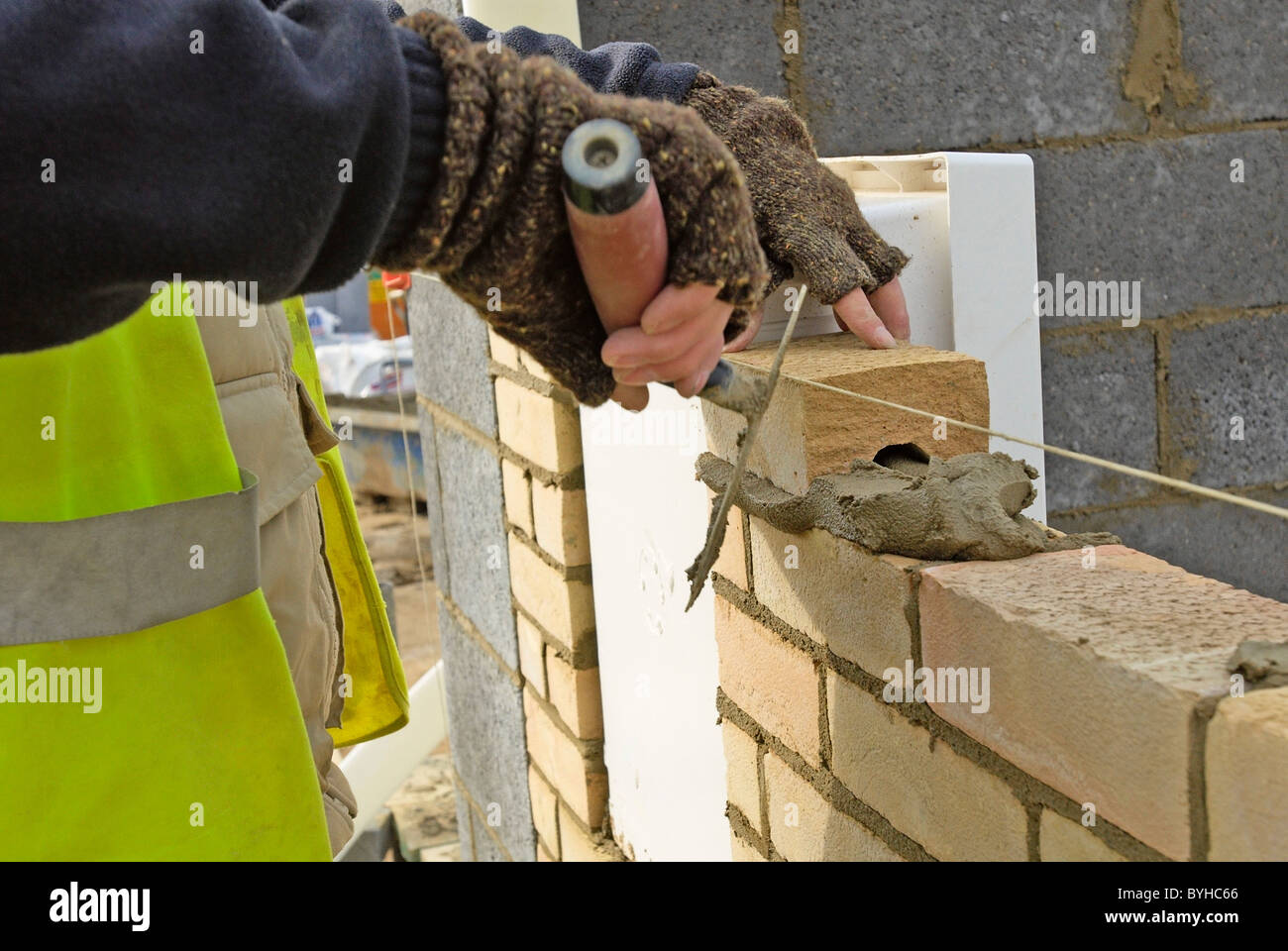 Laying bricks hands hi-res stock photography and images - Alamy