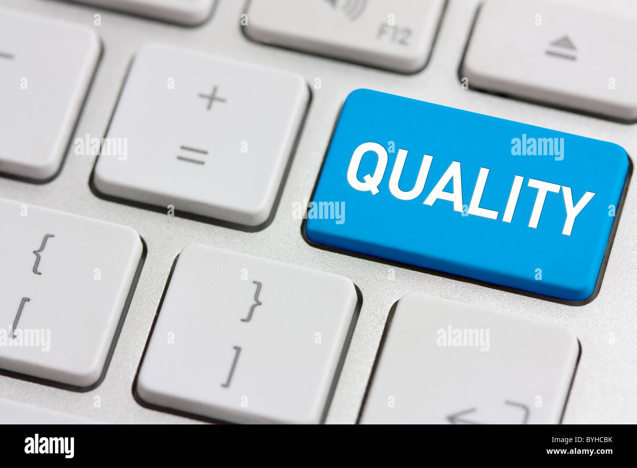 quality keyboard button on a modern silver computer Stock Photo - Alamy