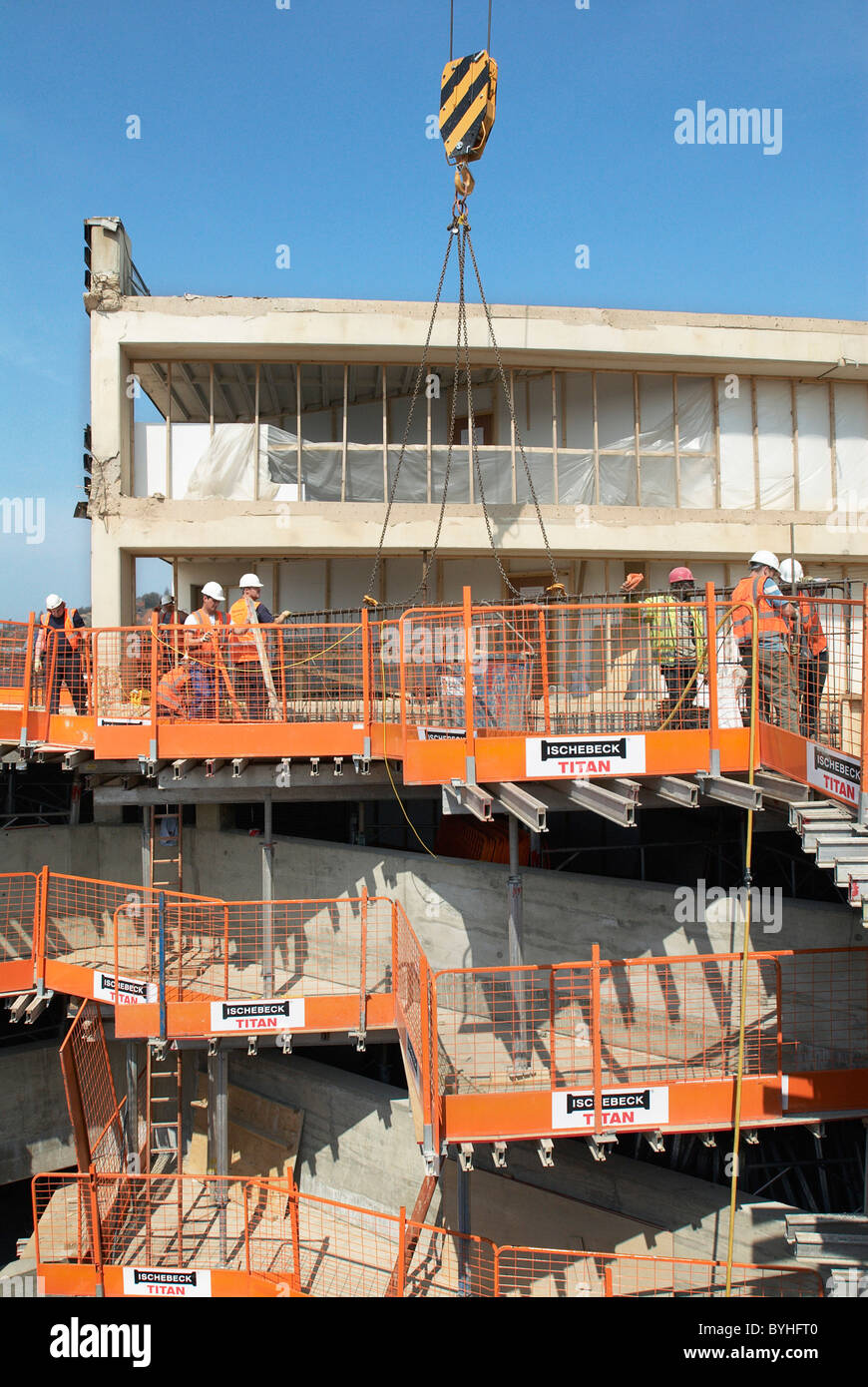 Different levels of a multi-storey car park under construction with ...