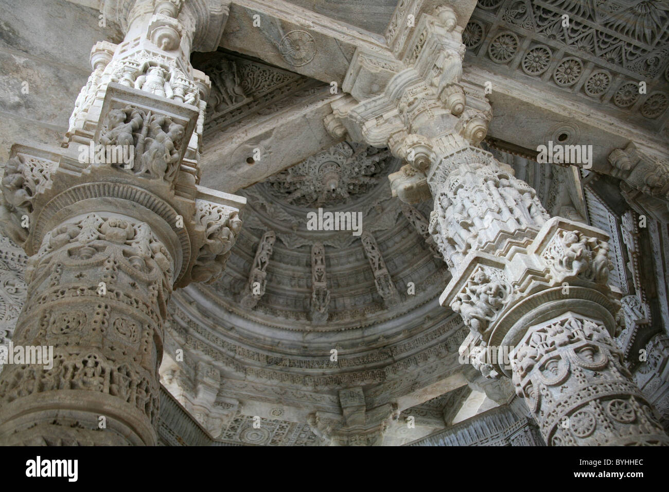 Carved white marble pillars and ceiling at Adishwar Chaumukha Mandir ...