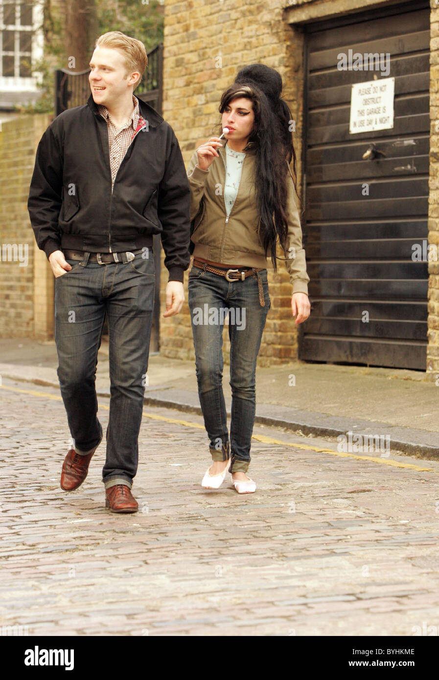 Amy Winehouse and Alex Jones-Donelly leaving their house. Amy is ...