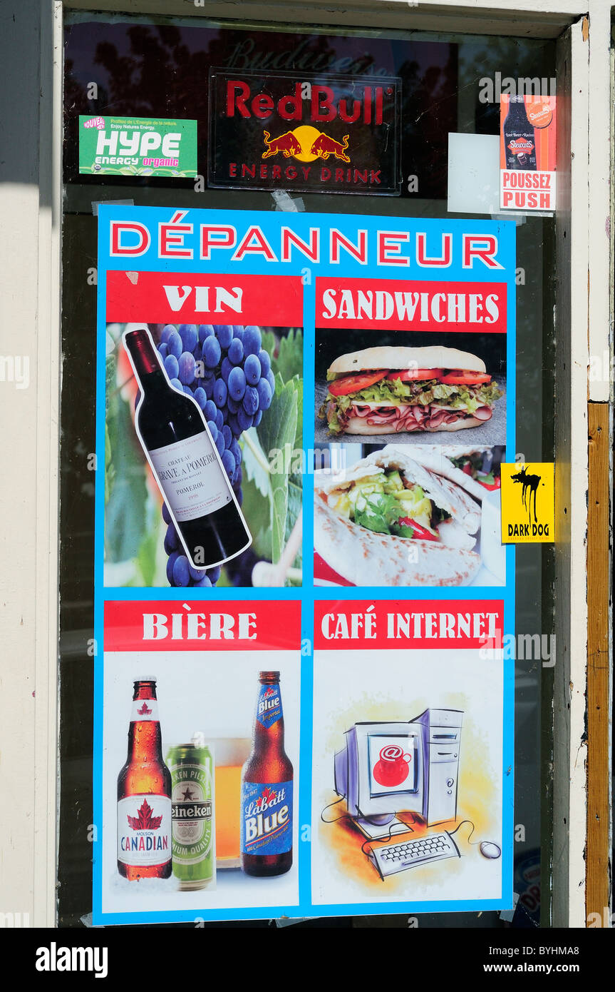 Convenience Store Advertising Sign In The Window Stock Photo - Alamy