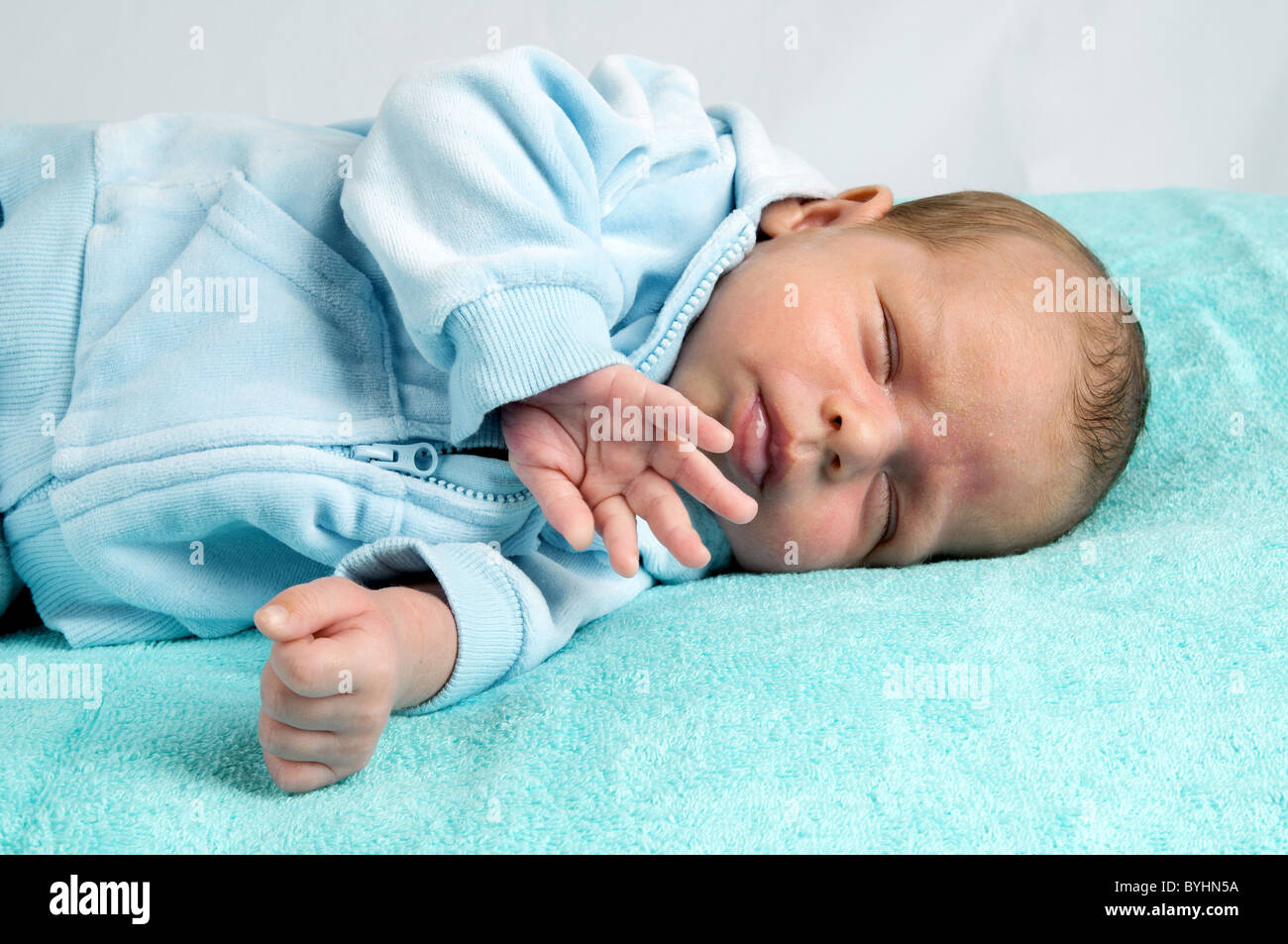 Sleep baby in blue Stock Photo - Alamy