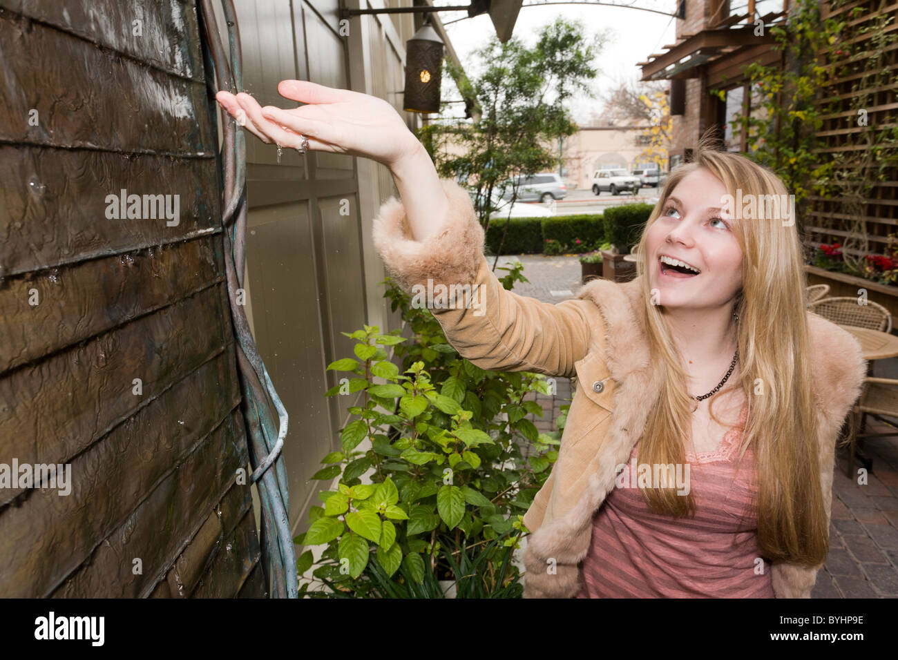 Young woman holding right hand out Stock Photo - Alamy