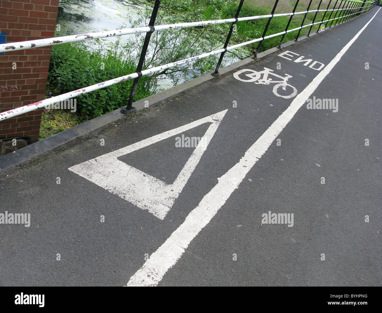 Cycle path with signs painted on the tarmac Stock Photo - Alamy